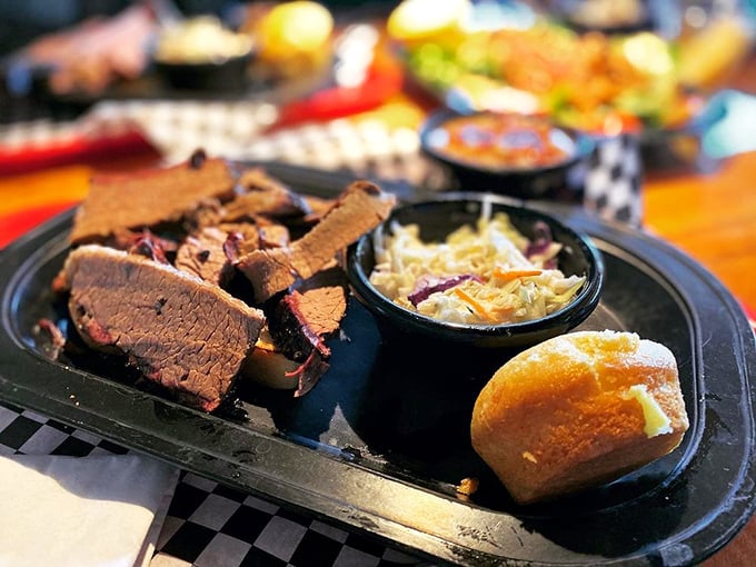 Brisket and ribs sharing a plate like old friends at a reunion, with sides that refuse to be overshadowed by the meaty main attractions. 