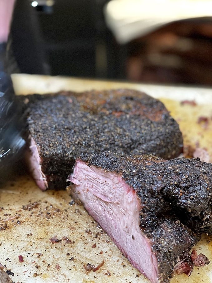 The bark on this brisket could make a Texas pitmaster weep with joy. That peppery crust is what barbecue dreams are made of.
