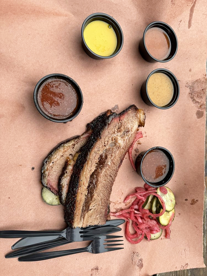 A meat lover's still life: perfectly smoked brisket with a rainbow of house sauces. Though purists might say great barbecue needs no accompaniment.