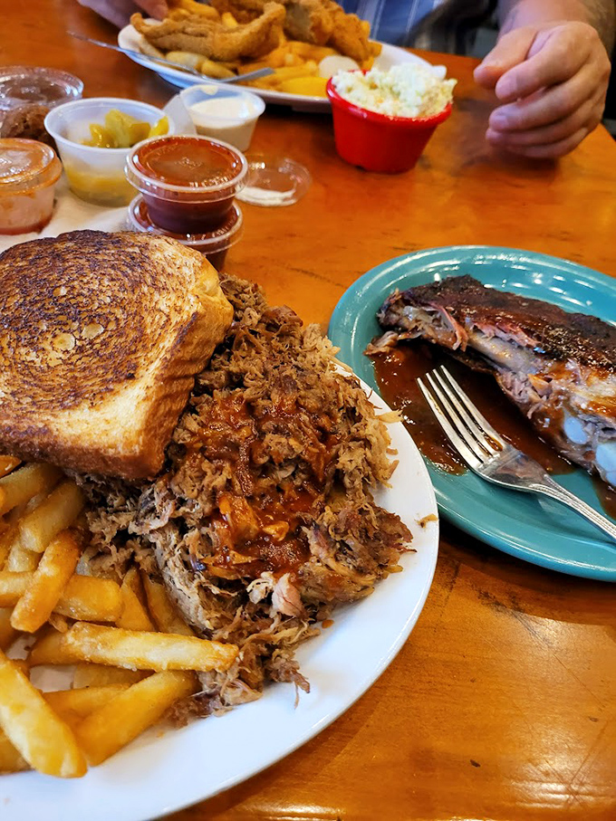 BBQ artistry at its finest&mdash;tender pulled pork alongside ribs with the perfect bark. The sauce cups are standing by, but they're hardly necessary.