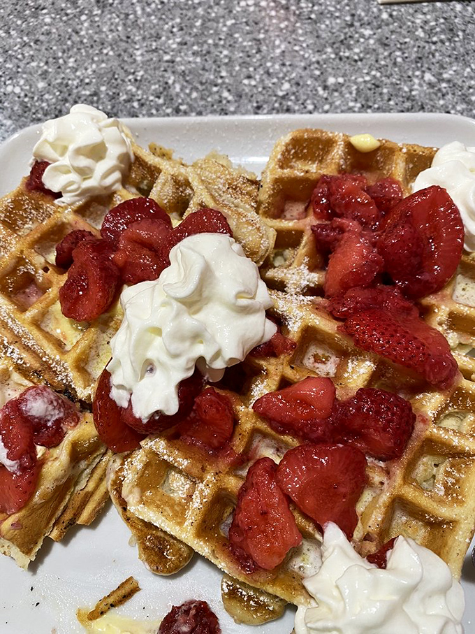 These waffles arrive looking like they're dressed for the prom&mdash;strawberries and whipped cream in formal attire.