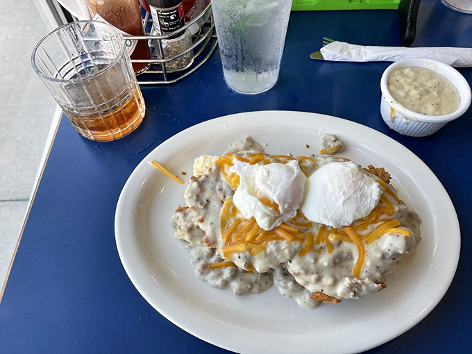 Not all heroes wear capes—some come smothered in creamy gravy, topped with poached eggs and melted cheese, ready to rescue your morning.