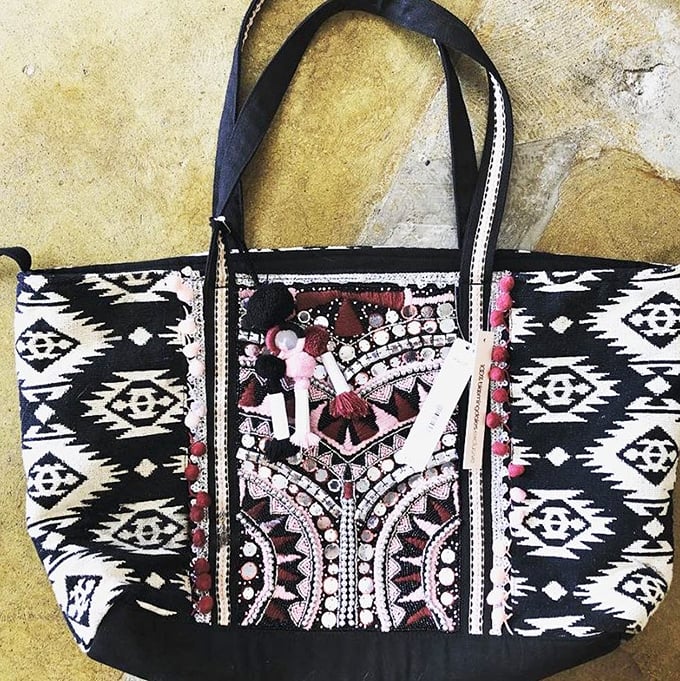 Not your grandmother's tote bag (unless your grandmother was incredibly stylish). This bohemian chic carryall brings artisanal flair to everyday errands.