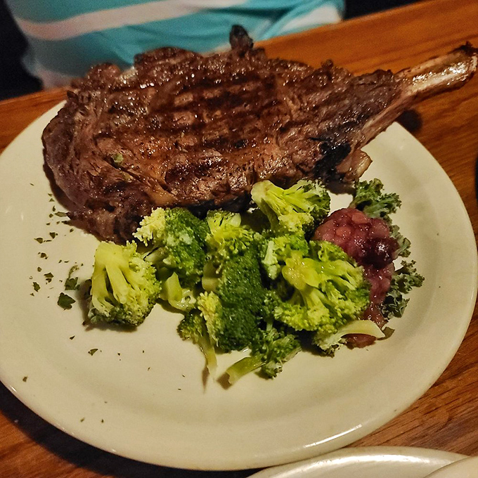 A bone-in ribeye with perfectly charred edges alongside bright broccoli&mdash;proof that sometimes the simplest combinations create the most profound happiness.