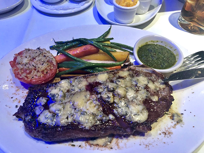 Blue cheese melting into the crevices of a perfectly charred steak with seasonal vegetables standing by? This isn't dinner; it's edible poetry with a side of vitamins.
