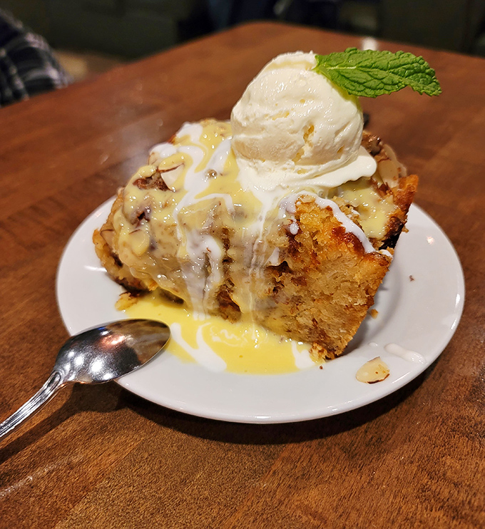 Bread pudding that would make your grandmother both jealous and proud. That vanilla ice cream melting into warm, cinnamon-spiced heaven is pure dessert drama.