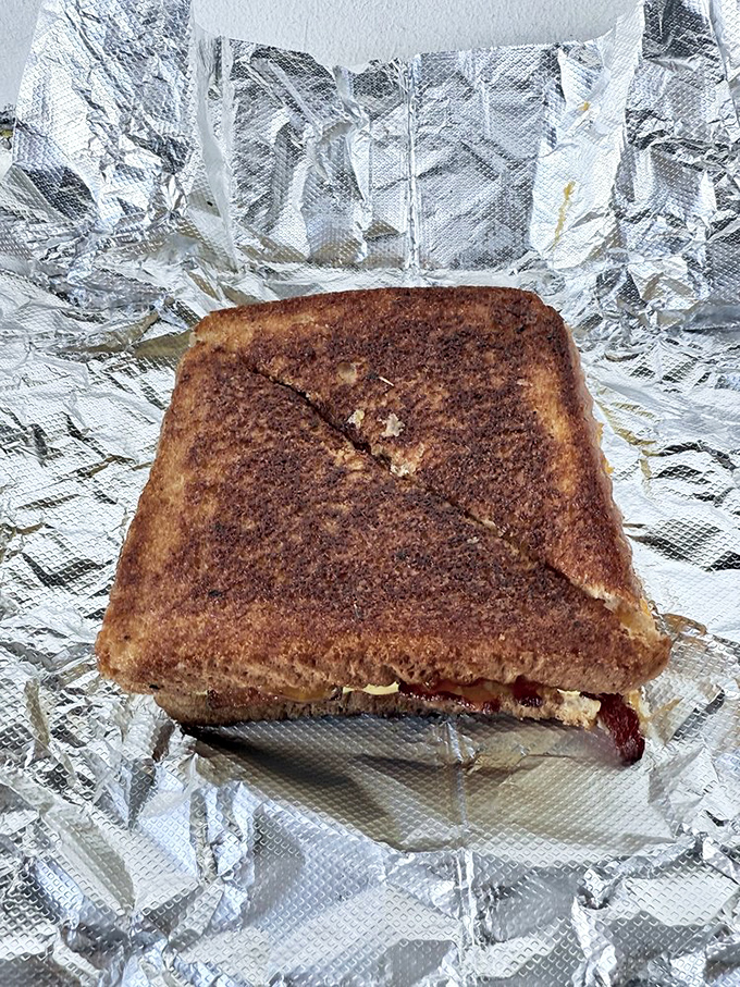 Golden-brown perfection wrapped in foil like the breakfast gift it is. This sandwich doesn't need Instagram filters &ndash; it's naturally photogenic.
