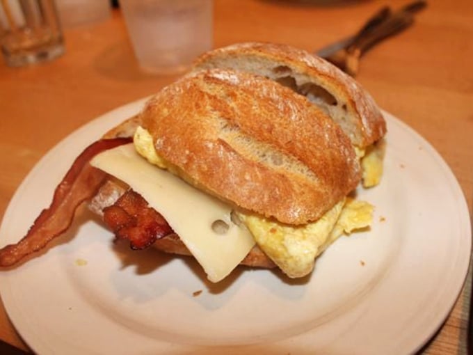 The breakfast sandwich that launched a thousand return visits. That artisanal bread deserves its own fan club.