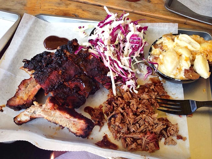 Barbecue nirvana on butcher paper: ribs with that perfect bark, pulled pork with ideal texture, and mac and cheese that demands attention.