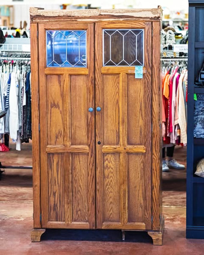 Not just a cabinet&mdash;a time machine with stained glass. Someone's grandmother probably kept her good china behind those doors for Sunday dinners only.