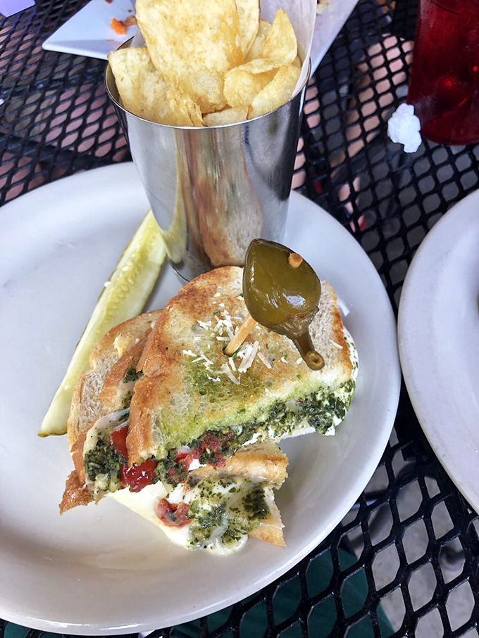 The Caprese Melt brings Italy to Arkansas with fresh mozzarella, pesto, and tomatoes creating a symphony of Mediterranean flavors.