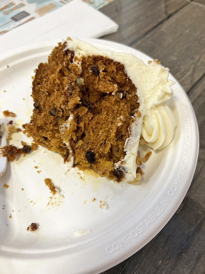The cross-section reveals the truth: this isn't just carrot cake, it's a spice-laden archaeological dig where each layer tells a delicious story.