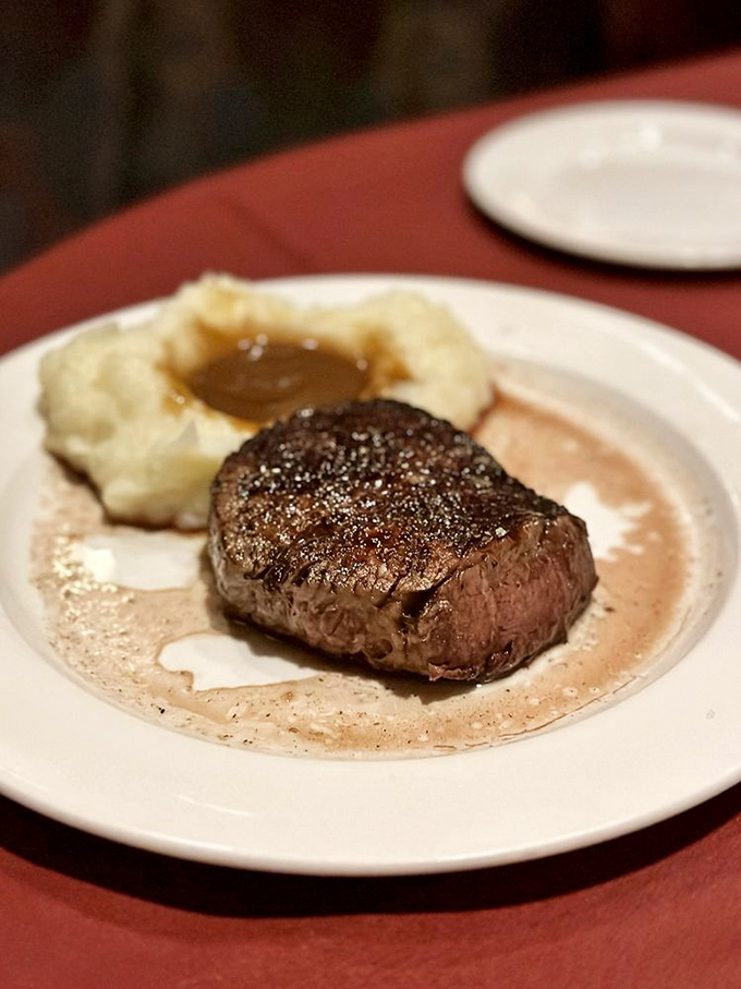 This filet mignon isn't just a steak; it's a masterpiece of meatcraft with mashed potatoes so creamy they could solve international conflicts.