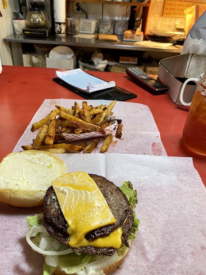 A burger that doesn't need Instagram filters. The crispy fries and fresh salad are just supporting actors in this delicious drama.