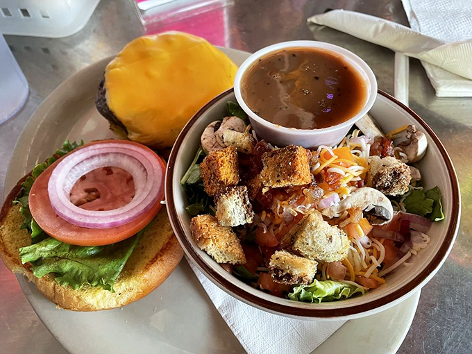 When your burger needs a side salad for moral support, you know you're in for a meal that requires both hands and zero regrets.