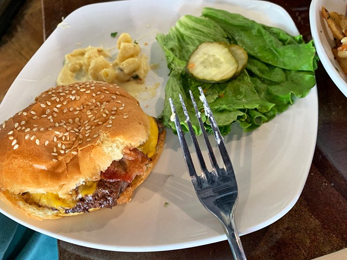 This burger and its bacon sidekick are having a party, and your taste buds just got VIP access. The mac and cheese is there for moral support.