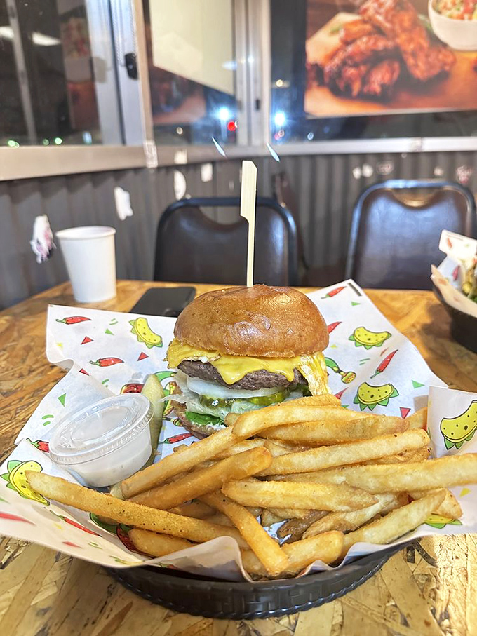 This classic cheeseburger comes with perfectly crisp fries on whimsical cartoon-decorated paper &ndash; proof that sometimes the simplest pleasures are the most satisfying.