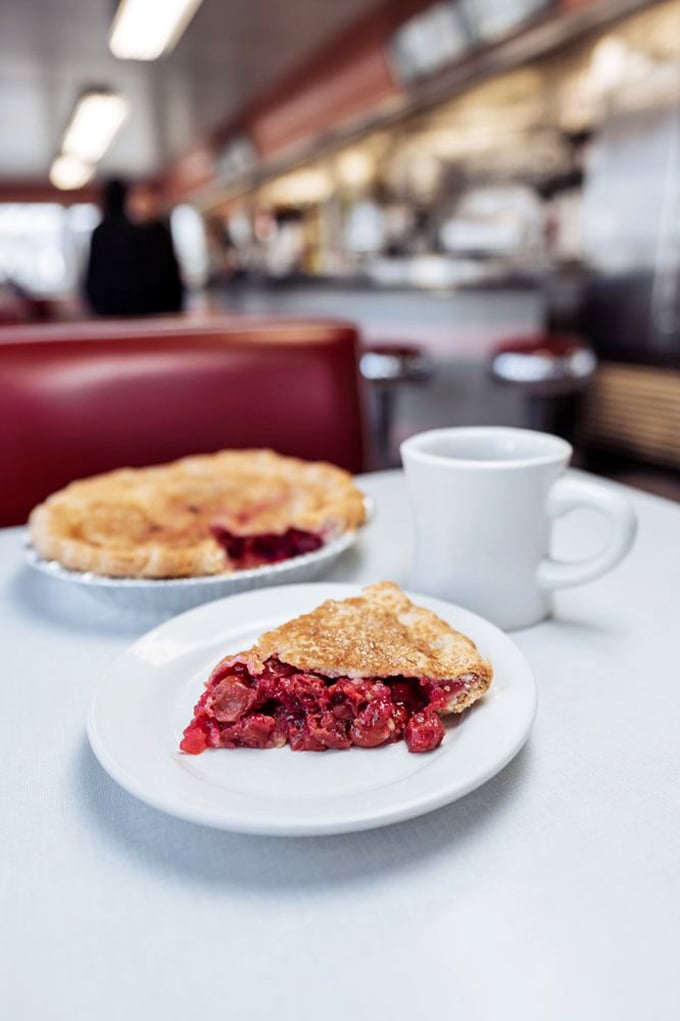 Cherry pie so vibrant it could make a stoplight jealous. That flaky crust is holding back a ruby avalanche just waiting to meet your fork.