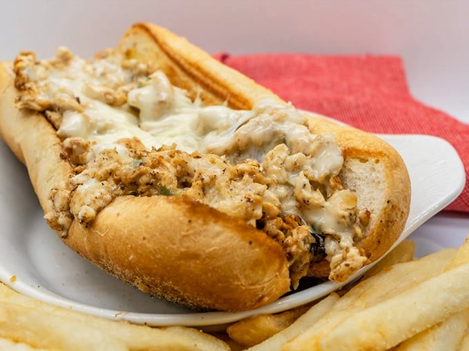 The chicken cheesesteak proves that beef isn't the only path to sandwich nirvana. That melty cheese blanket is working overtime to create pure comfort food magic.