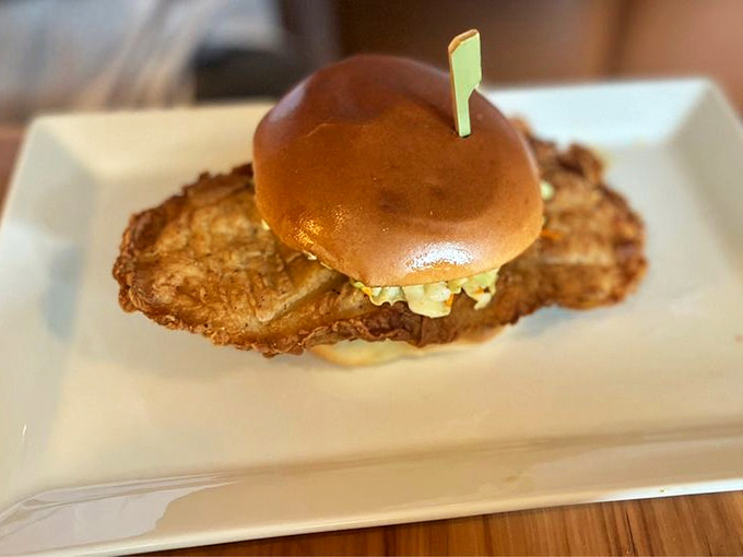 This isn't just a chicken sandwich&mdash;it's architecture with flavor. The crispy exterior gives way to juicy perfection, all nestled on a brioche throne.