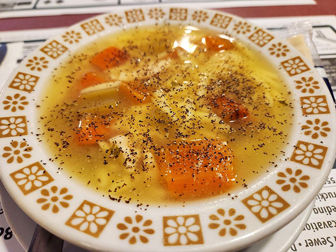 Chicken soup: the universal penicillin. Those little flecks of black pepper are doing more for your soul than any meditation app ever could.