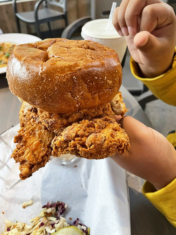 The sandwich that launched a thousand napkins—crispy chicken nestled in a pillowy bun that's worth every calorie.