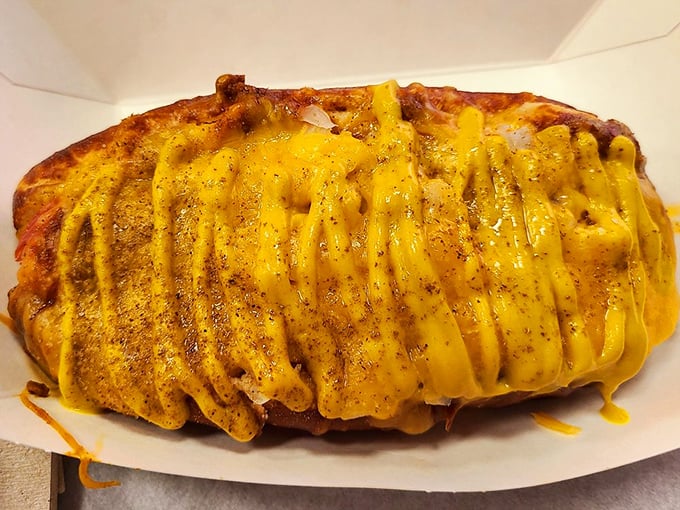 This isn't just a hot dog &ndash; it's a golden blanket of cheese covering a meaty masterpiece that makes you question why you'd eat anything else.