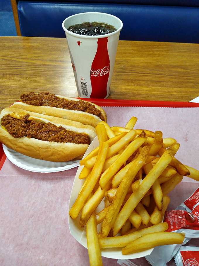 The classic combo that's launched a thousand road trips&mdash;a Texas Hot Dog with a side of golden fries and an ice-cold Coca-Cola. Happiness on a paper plate.