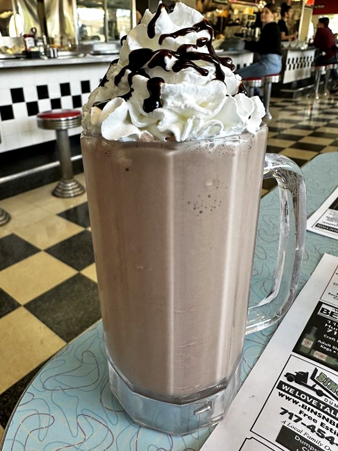 This chocolate milkshake isn't just a drink, it's an engineering marvel of dairy perfection that would make Willy Wonka weep with joy. 