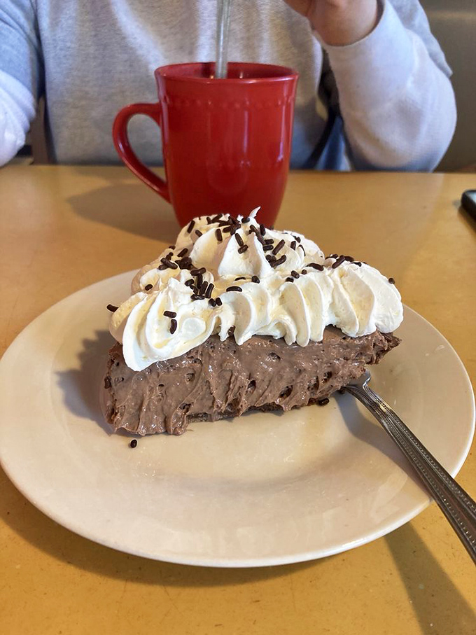 Chocolate cream pie topped with a cloud of whipped cream &ndash; where the line between dessert and legitimate reason to get out of bed blurs beautifully.