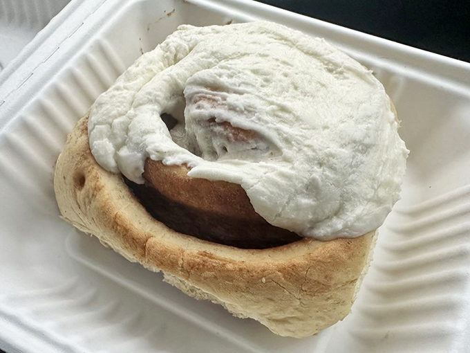 This cinnamon roll doesn't just have frosting&mdash;it's wearing a luxurious cream cheese blanket. Napkins required, but restraint impossible.