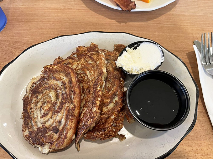 Cinnamon roll French toast: when someone asked, "How could we make French toast even better?" and the answer was brilliantly obvious. Served with real maple syrup, naturally.