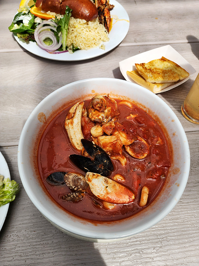 The legendary cioppino&mdash;a tomato-based symphony where every spoonful delivers a different seafood treasure. This isn't soup; it's an underwater expedition.