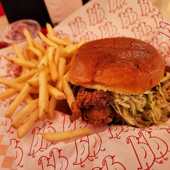 This isn't just a sandwich; it's architecture. Crispy chicken, fresh slaw, and a bun that knows its supporting role&mdash;all on that signature BB paper.