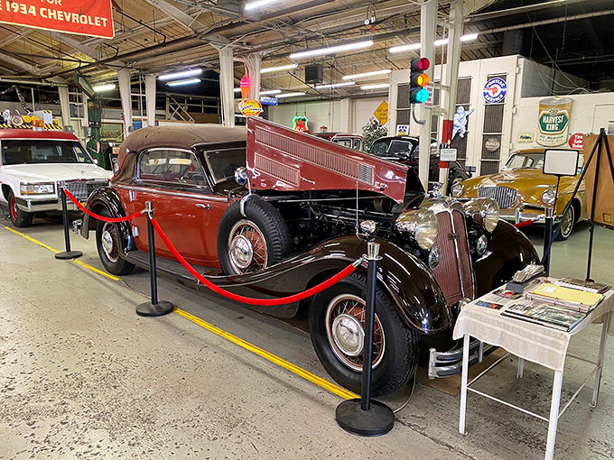 Vintage elegance in burgundy and black. This roped-off beauty reminds us when cars weren't just transportation&mdash;they were rolling art.