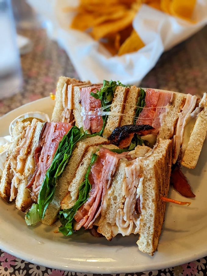 The club sandwich that towers with such authority, it deserves its own zip code. Those layers tell stories of flavor that no drive-thru could ever match.