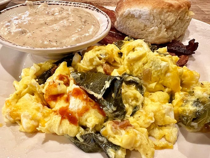 The Notely Scramble in all its glory&mdash;eggs, collards, and cheese creating a Southern symphony on a plate. Your fork is about to conduct a masterpiece.