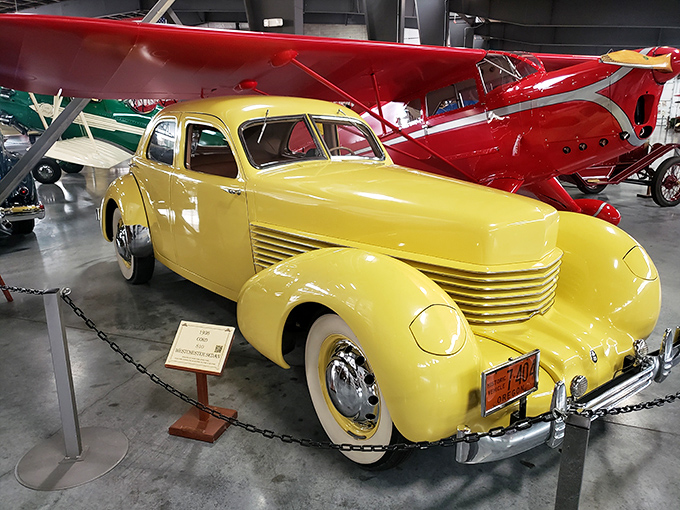 The canary-yellow Cord 812 represents automotive royalty, with streamlined elegance that makes modern cars look like they're trying too hard. 