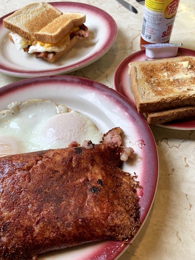 The breakfast sandwich and hash&mdash;a morning masterpiece that makes you question why anyone would wait in line for some fancy brunch with unpronounceable ingredients.