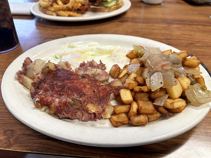 Breakfast of champions or hangover cure? This corned beef hash with eggs and home fries doesn't care why you're here, only that you leave happy.