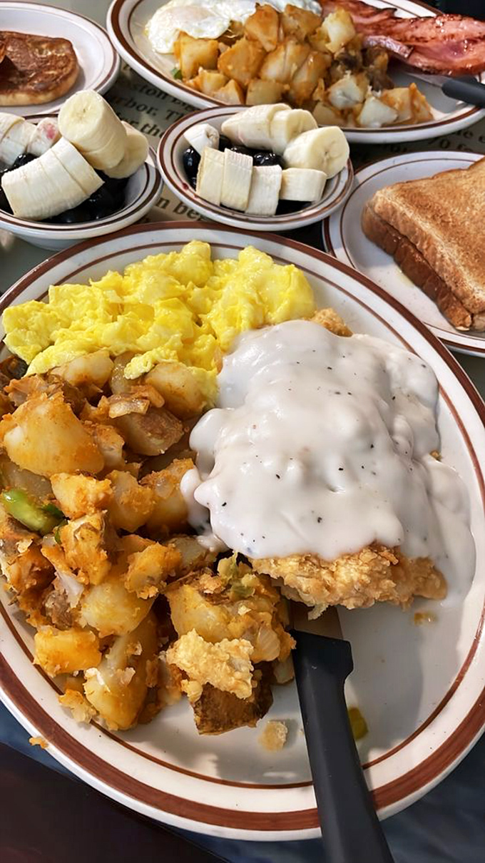 Country fried chicken swimming in peppery gravy alongside scrambled eggs and home fries&mdash;a plate that could fuel a farmer through harvest or a city slicker through meetings.