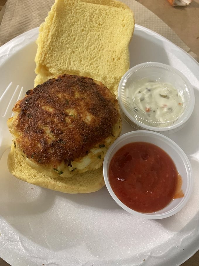The perfect crab cake sandwich: a masterpiece of simplicity where the star ingredient actually gets to shine, not hide behind fancy condiments.
