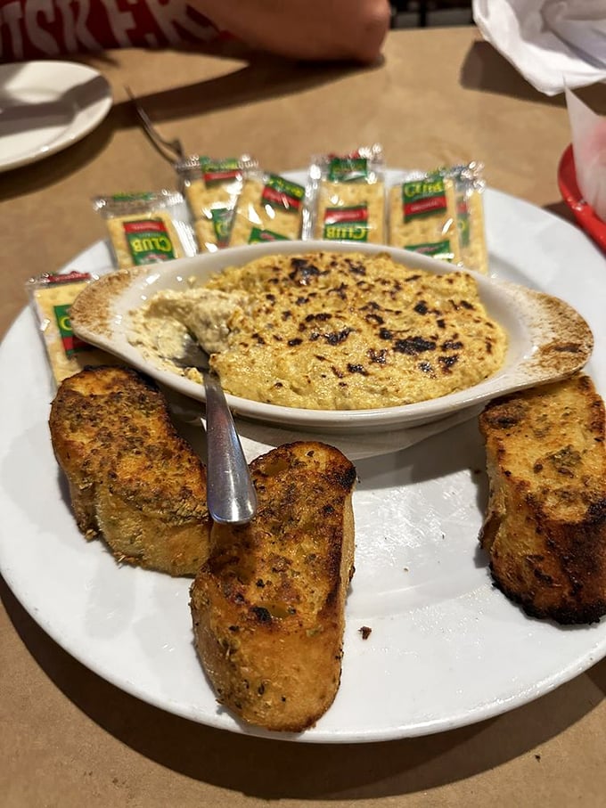 The crab dip arrives bubbling hot with golden-brown edges&mdash;that magical moment when cream, cheese, and crab create something greater than their parts.