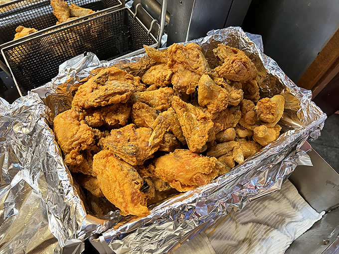 This mountain of perfectly fried chicken isn't just food &ndash; it's edible architecture with a PhD in crispiness and a minor in juiciness.