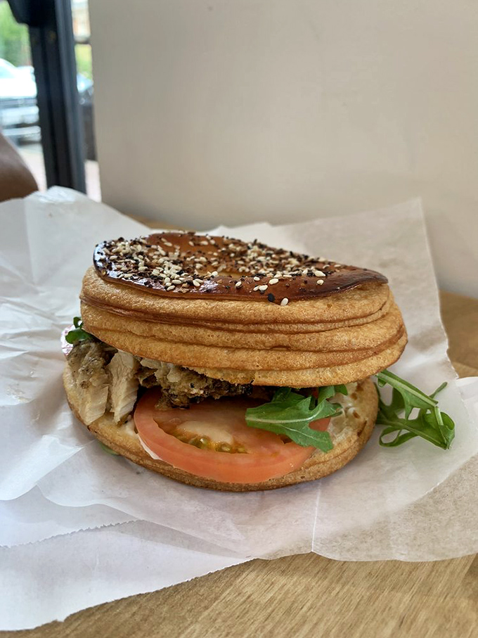 Village sandwich perfection &ndash; where chicken, arugula and tomato meet their destiny between golden discs of that signature Cro'Gel. Lunch has been upgraded.
