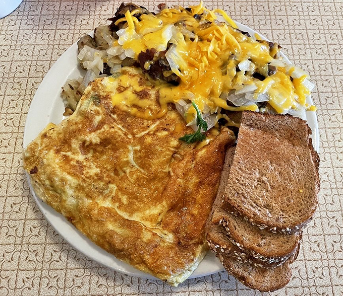 The Denver omelet doesn't just arrive&mdash;it makes an entrance, wearing a crown of melted cheddar and surrounded by a royal court of hashbrowns.