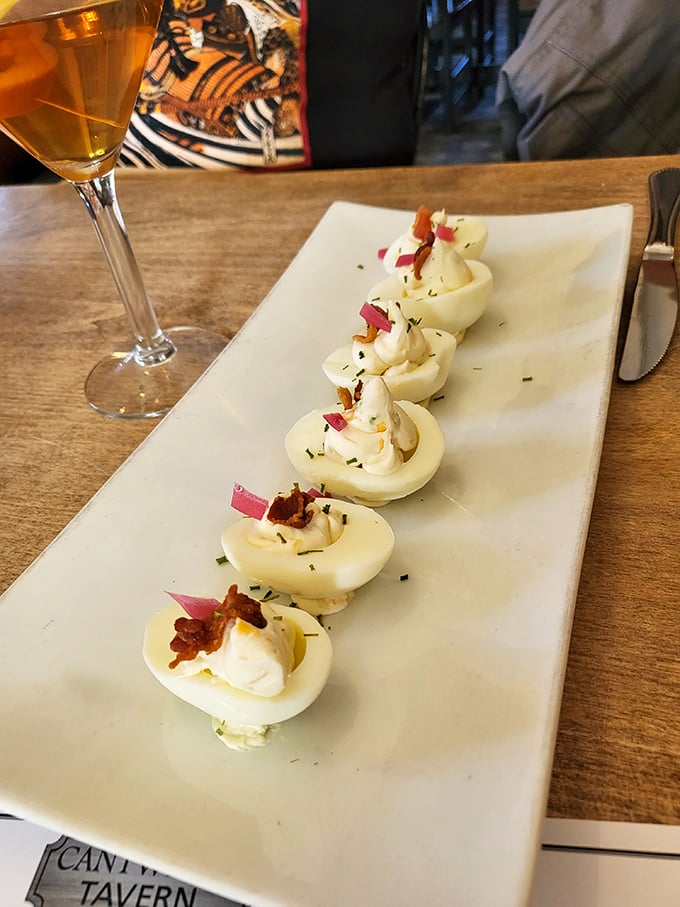 The deviled egg lineup looks like it's auditioning for a food magazine cover. That apple board in the background is playing a perfect supporting role.