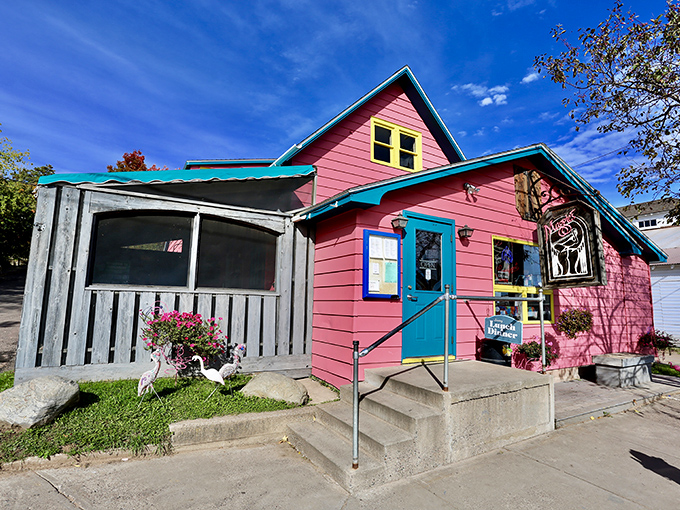 This vibrant pink building isn't just eye-catching&mdash;it's a promise of the equally colorful characters and conversations waiting inside.