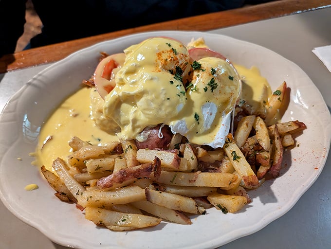 These eggs Benedict aren't just topped with hollandaise&mdash;they're swimming in liquid gold atop a mountain of perfectly crisped potatoes.