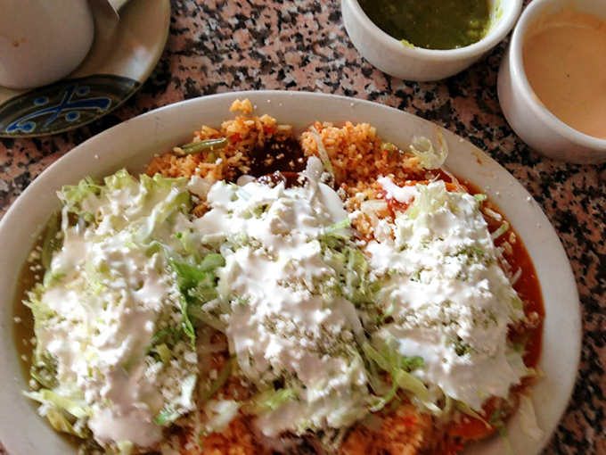 Supreme indeed! Those enchiladas wear their toppings like a crown&mdash;sour cream, lettuce, and cheese creating a beautiful mess worth every napkin.